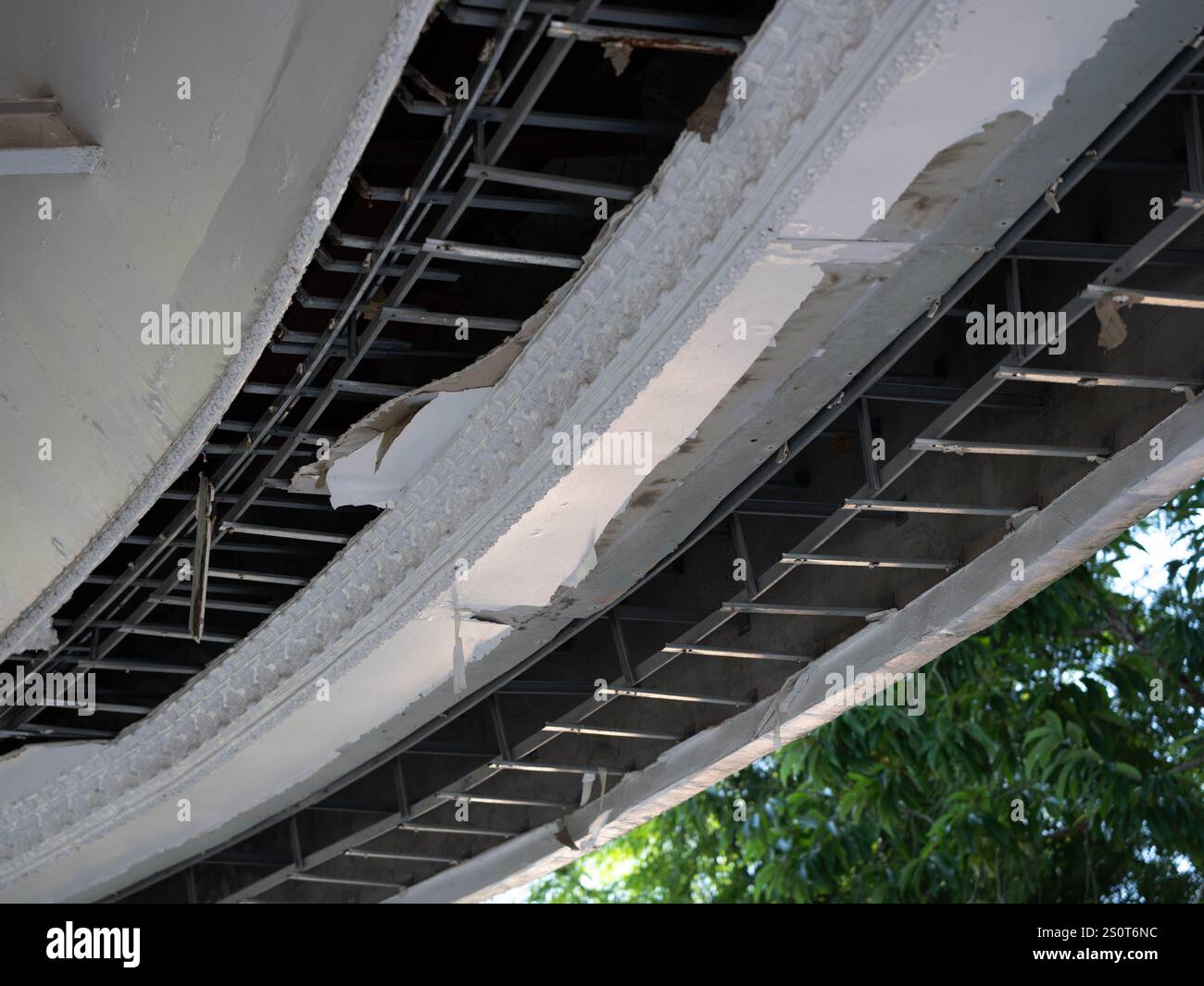 Ceiling panels damaged a large hole in the roof from rainwater leakage ...