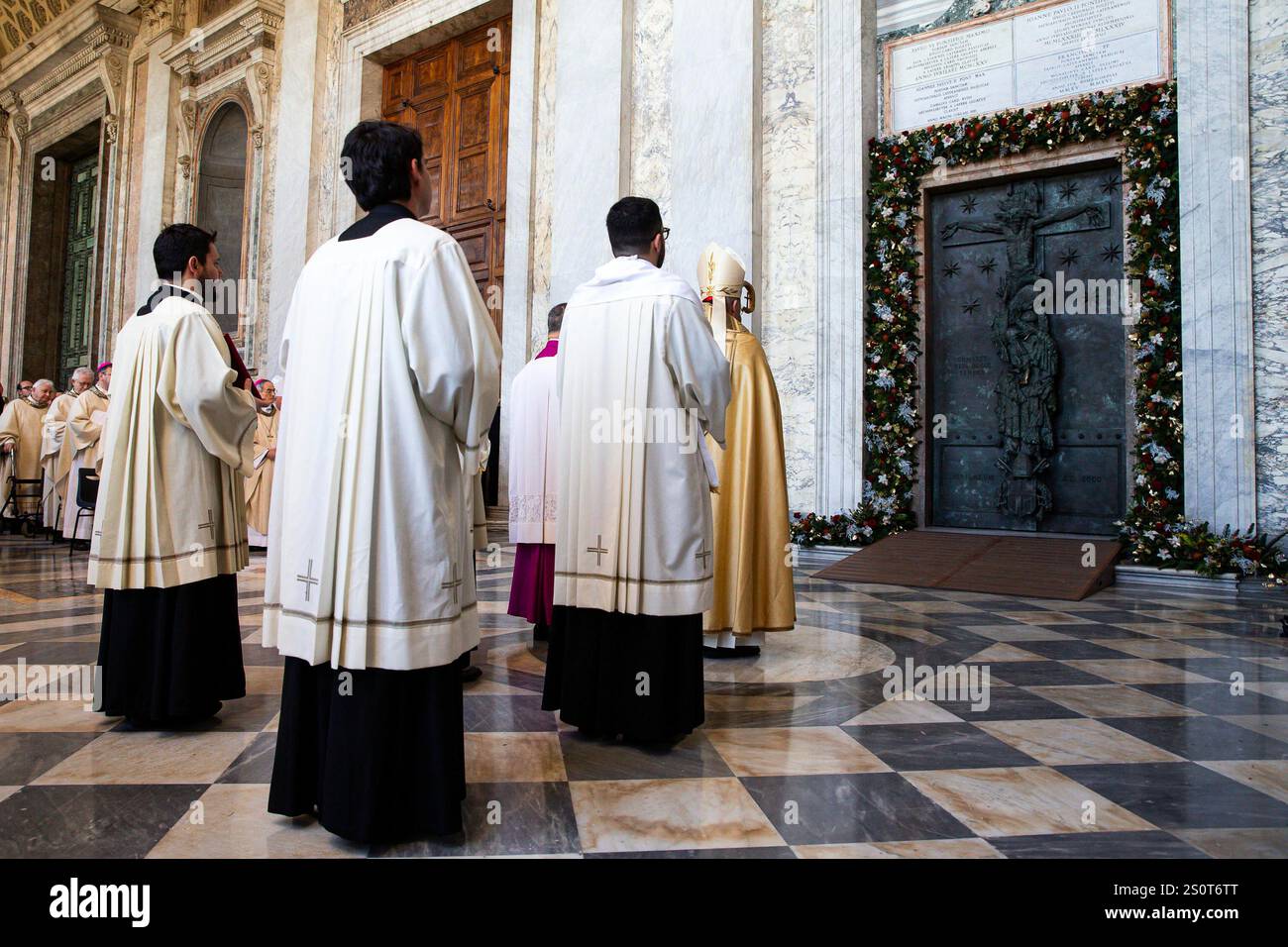 Cardinal Baldassare Reina, right, arrives to open the Holy Door of Rome ...