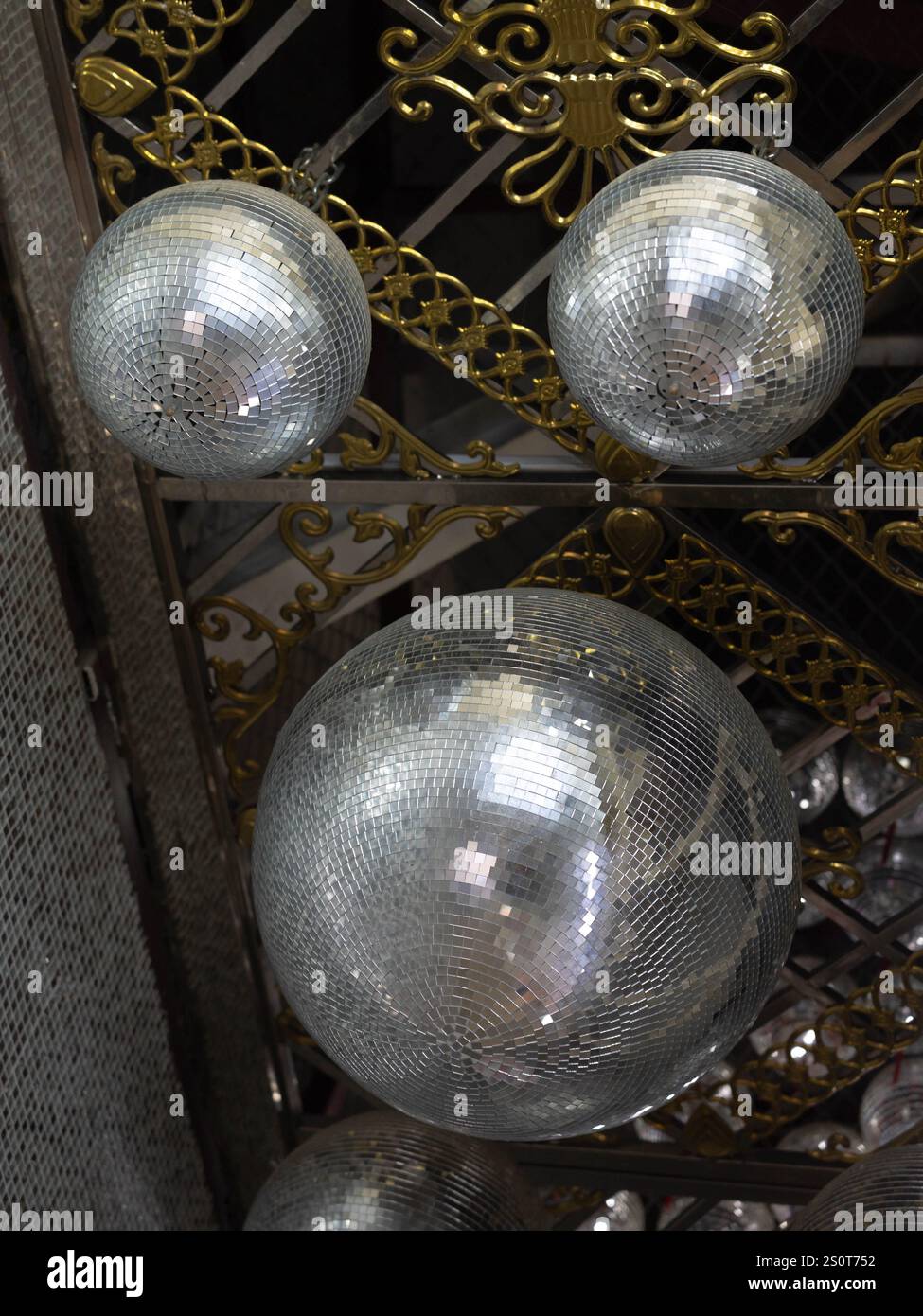 Disco ball hanging from the ceiling for decoration. Close-up of a ...
