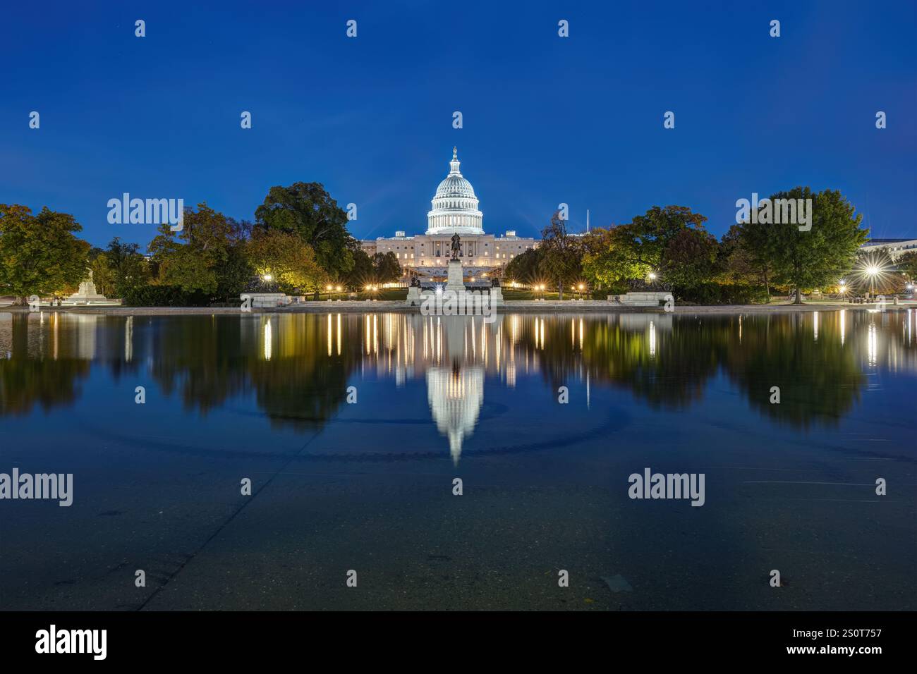 The illuminated United States Capitol in Washington DC at twilight with ...