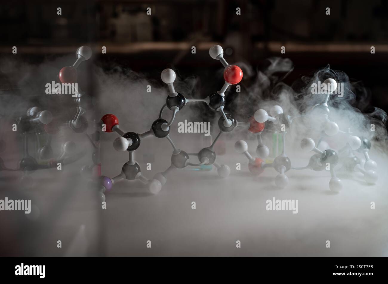 Smoky experiments with molecular model. Scientist working on chemical ...
