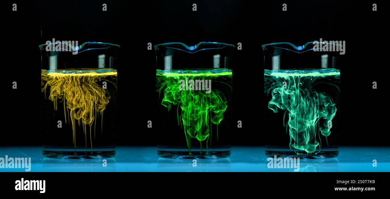 Dissolution and spread of a coloured chemicals in flask with a clear ...
