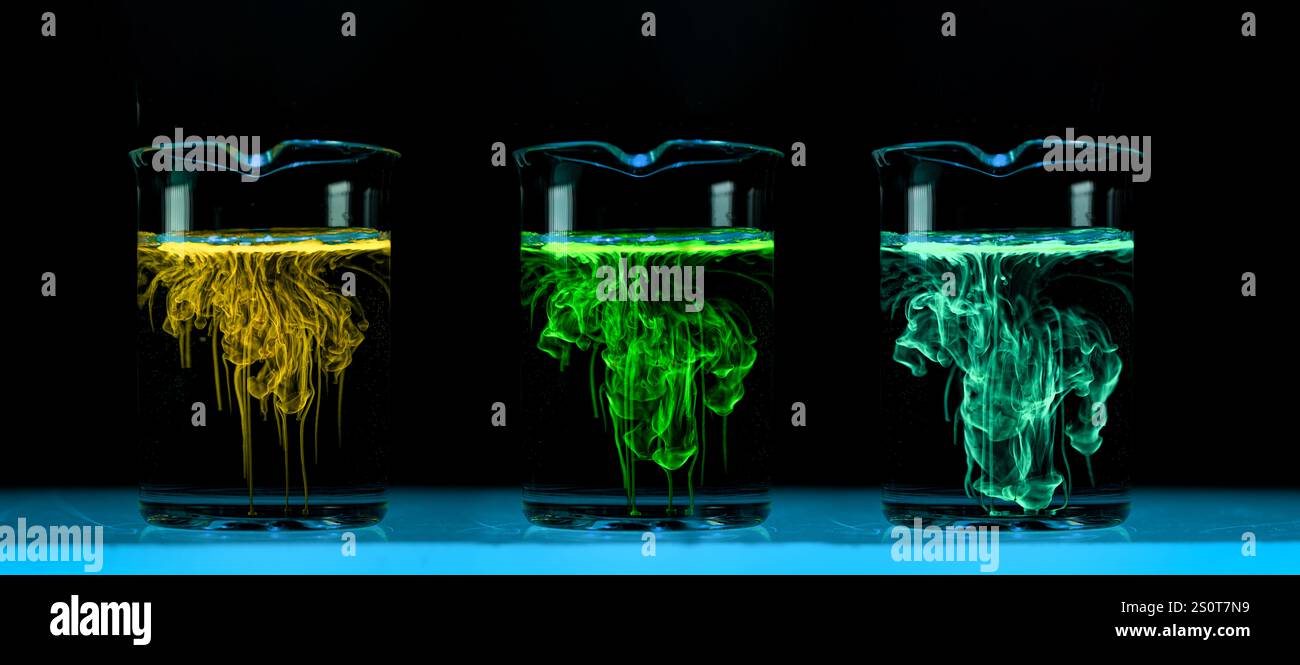 Dissolution and spread of a coloured chemicals in flask with a clear ...