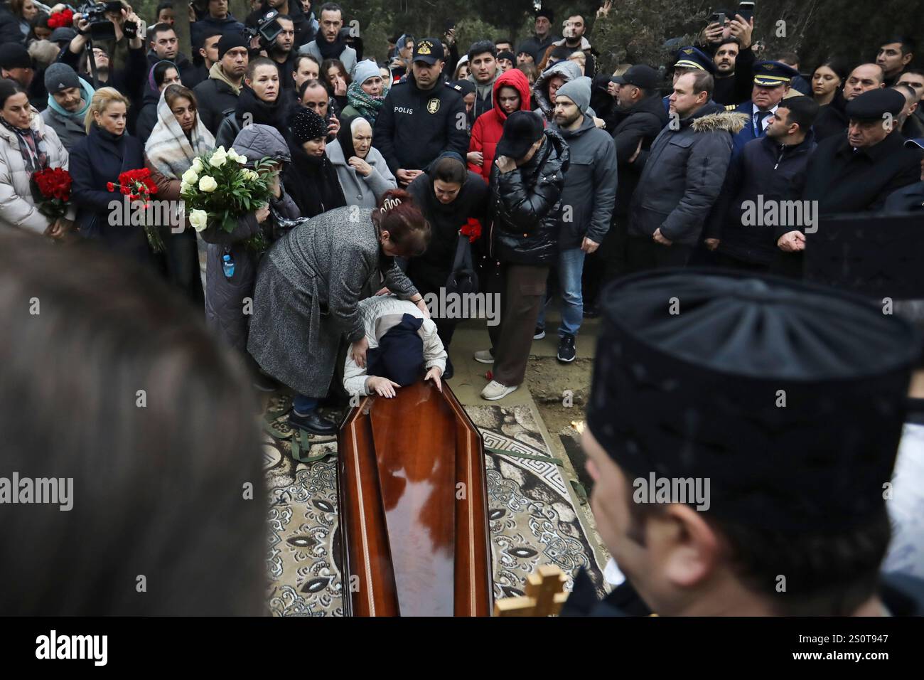Yana Kshnyakina, widow of pilot in command Igor Kshnyakin mourns during ...