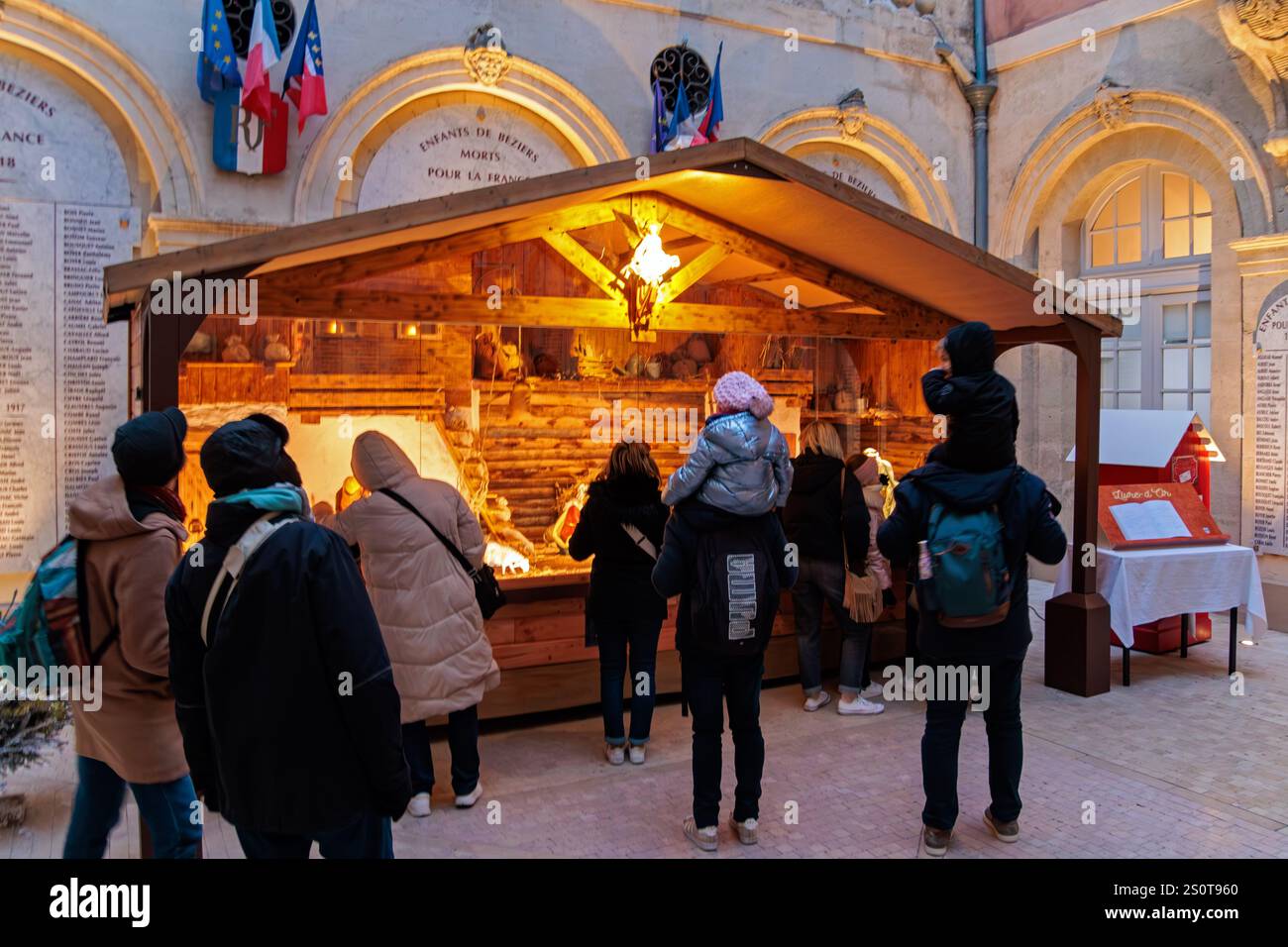 Christmas nativity scene inside the city hall patio. Beziers, Occitanie ...