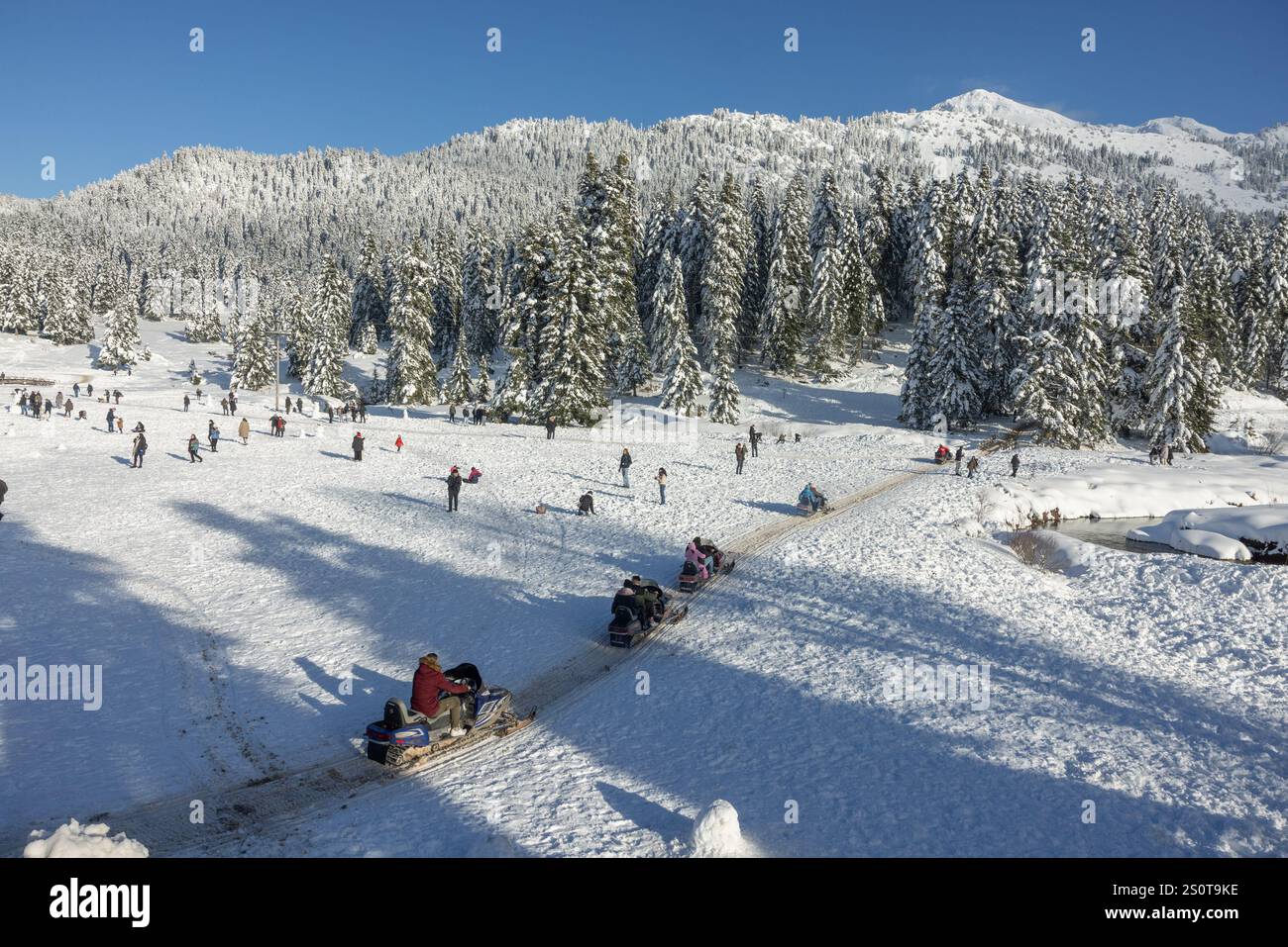 Athens. 27th Dec, 2024. People play with snow at a ski center in ...