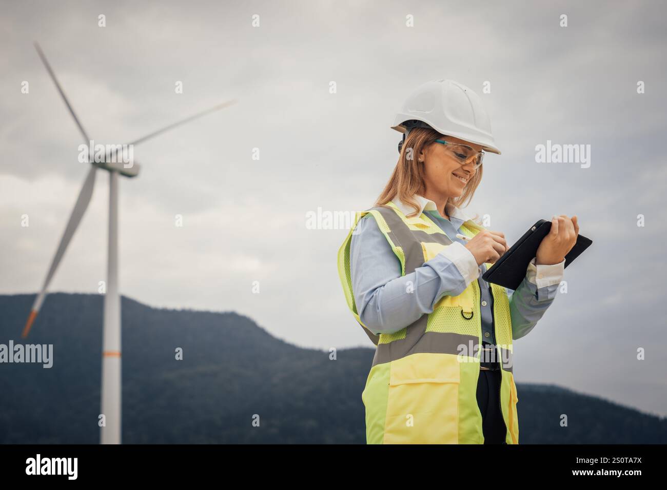 Engineer monitors operation wind turbines hi-res stock photography and ...