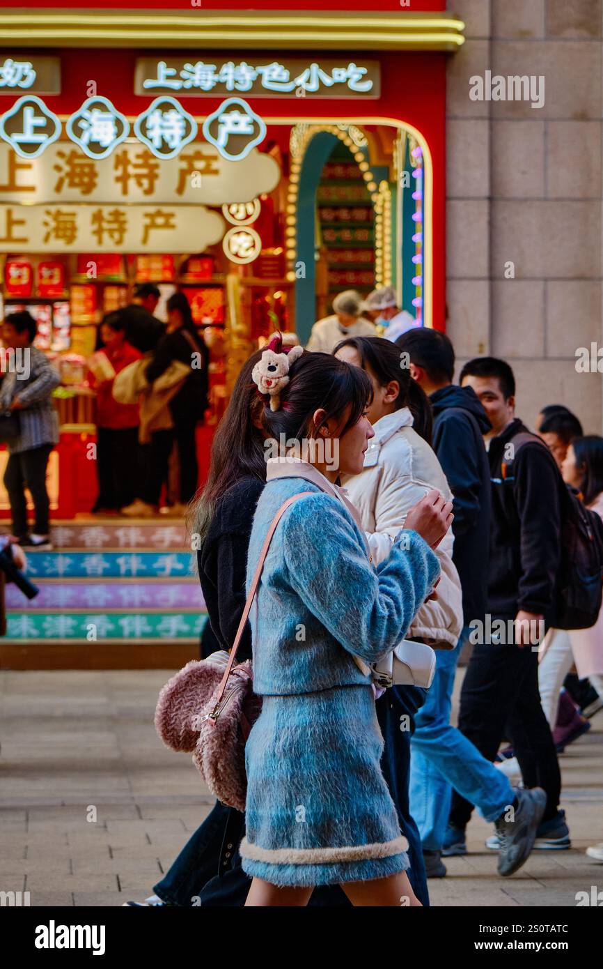 Shanghai, China 12.01.2024: Shanghai Street Life: A young chinese woman ...
