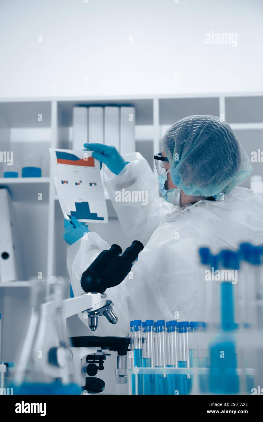 A dedicated scientist is analyzing data in a lab, highlighting microscopys crucial role in ...
