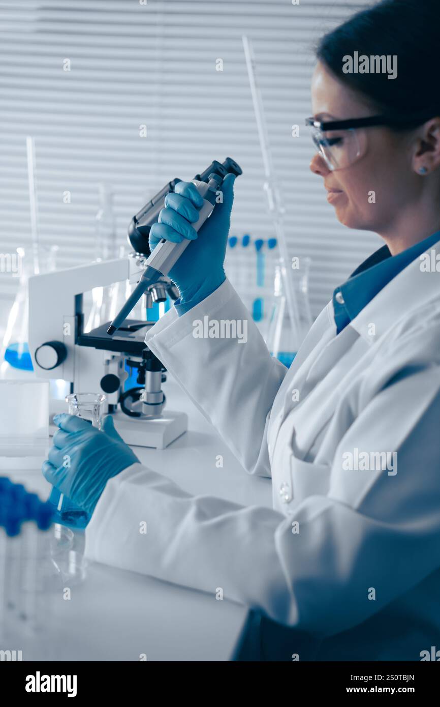 A dedicated scientist is in the laboratory, meticulously conducting ...