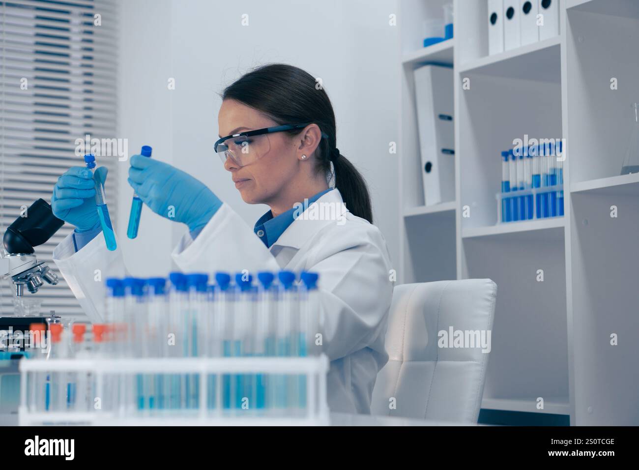 A scientist is performing a detailed analysis of various test tubes in ...