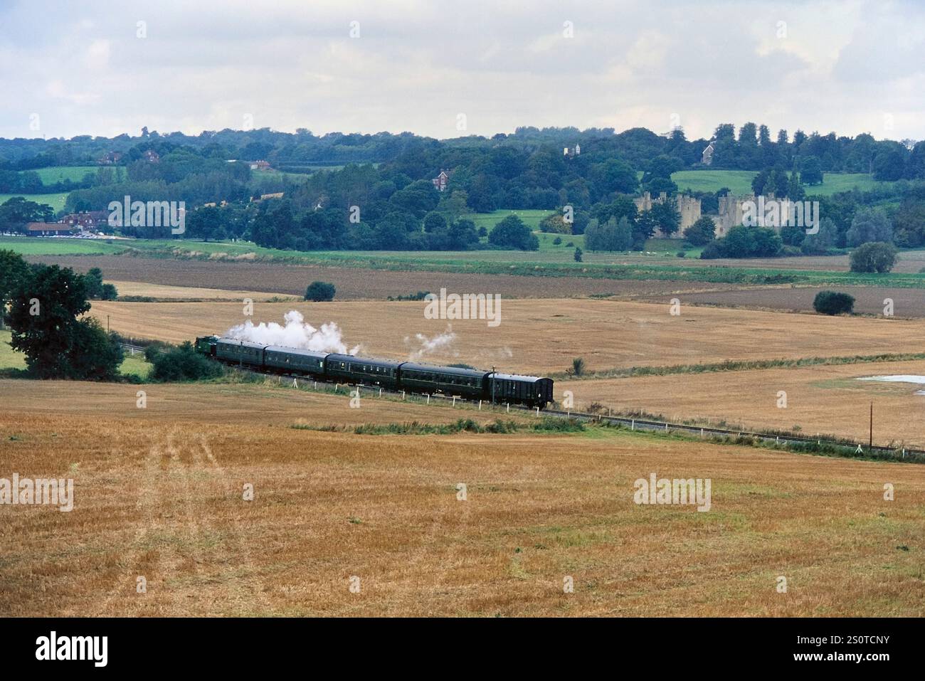 A steam locomotive with passenger carridges on the Kent & East Sussex ...