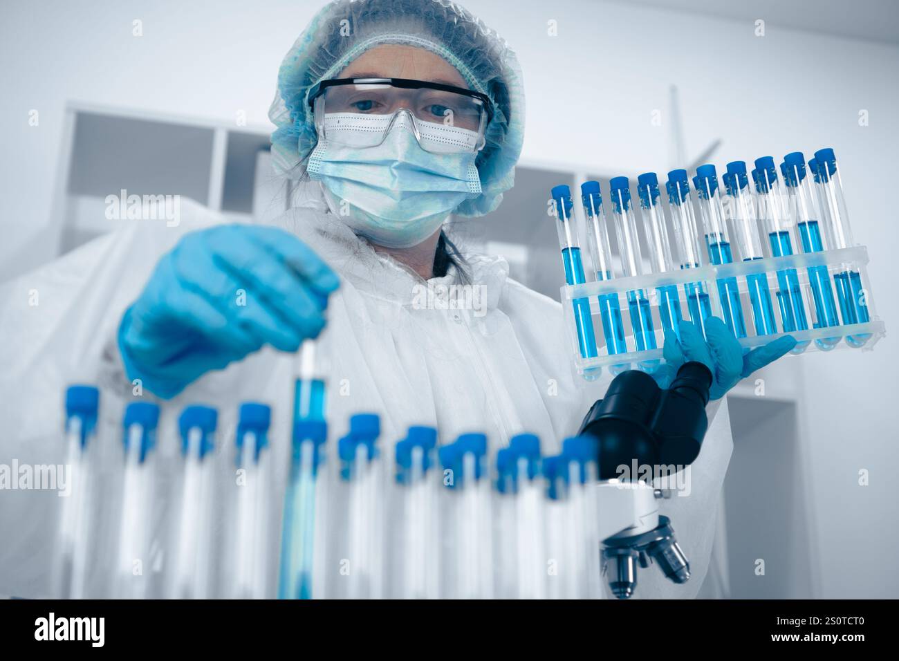 A skilled and meticulous Laboratory Technician expertly handling ...