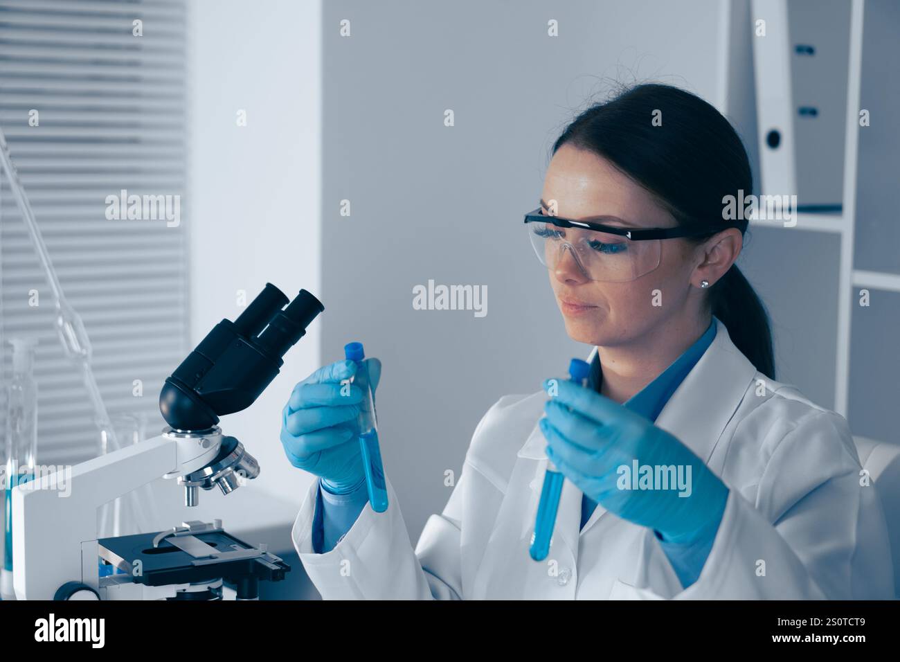 A dedicated laboratory professional is meticulously analyzing test ...