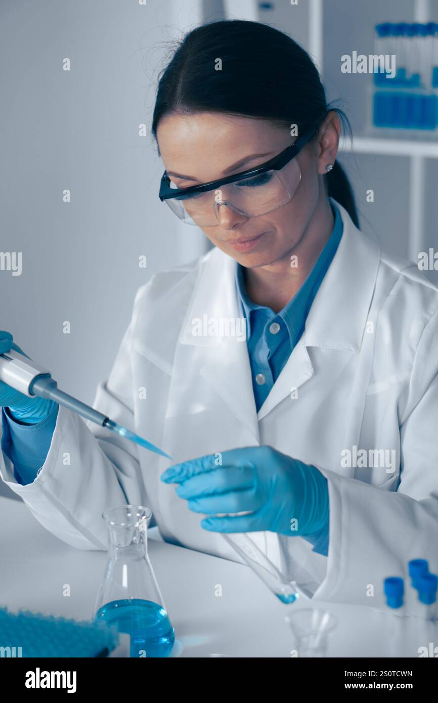 A Female Scientist is actively conducting a detailed laboratory ...