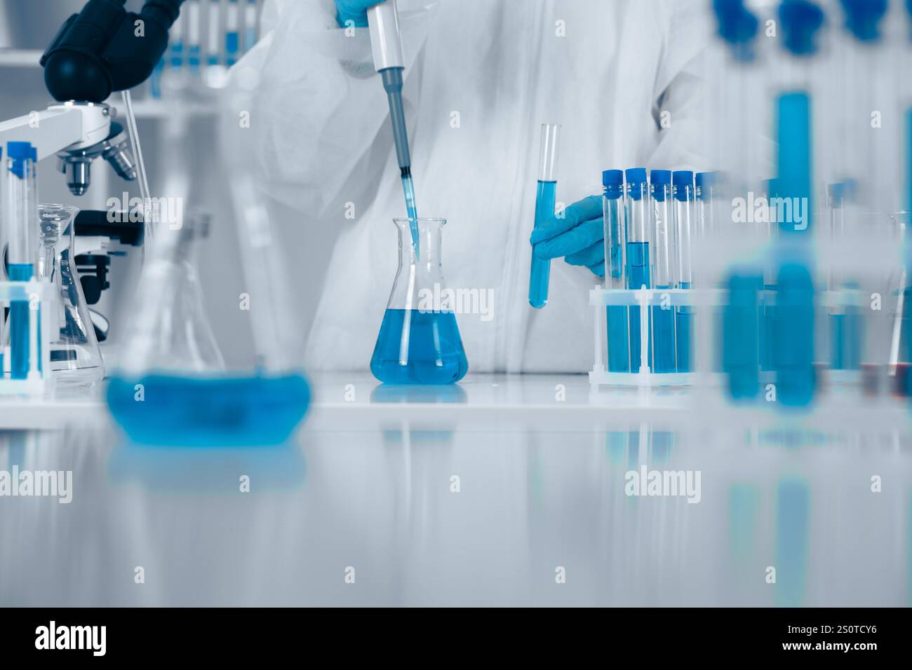 A dedicated scientist conducts detailed liquid measurements in a ...