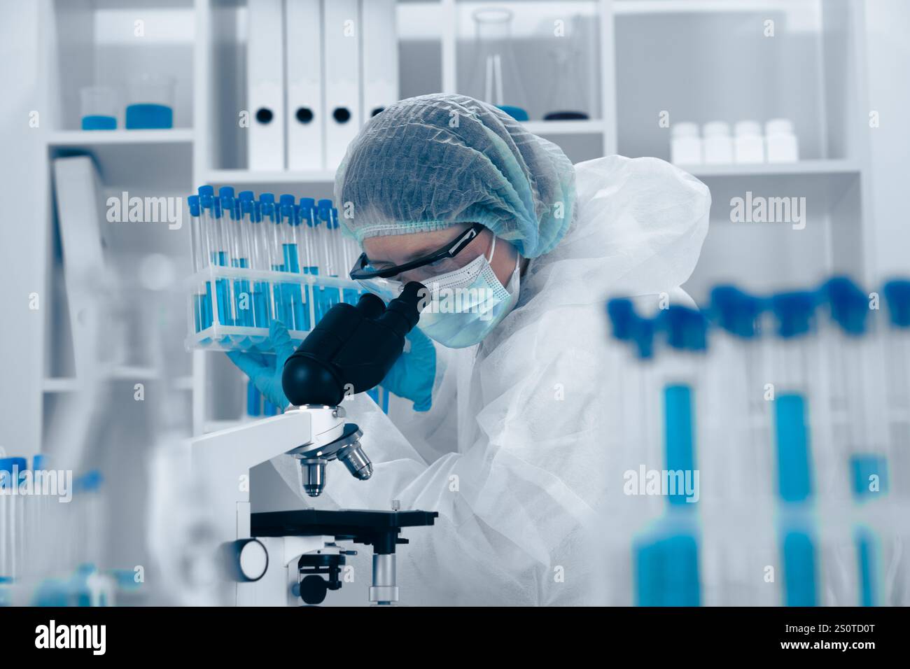 A dedicated Research Scientist is analyzing samples in a hightech lab ...