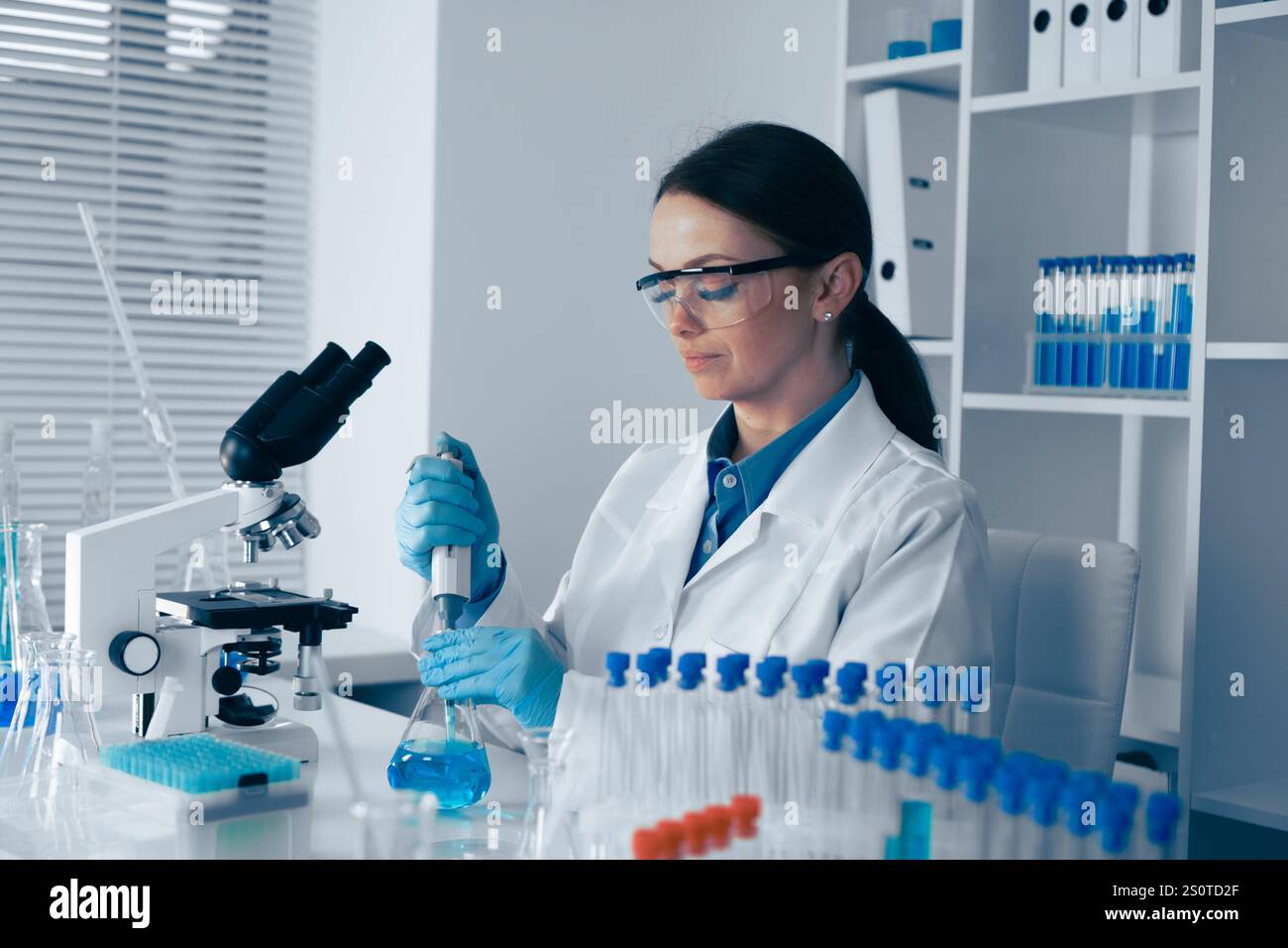 A dedicated scientist conducts impactful research in a modern lab ...