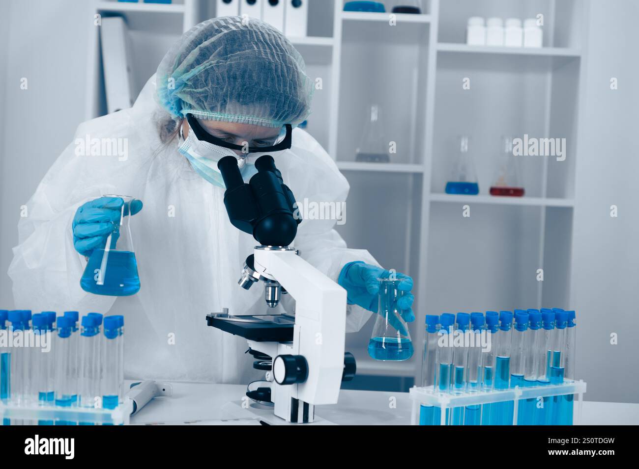 A dedicated scientist diligently engaged in extensive research ...