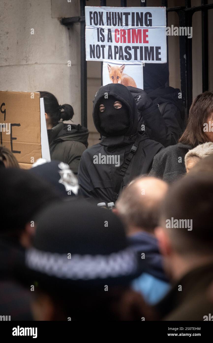 Hunt protesters hold placards in protest of hunting using dogs and ...