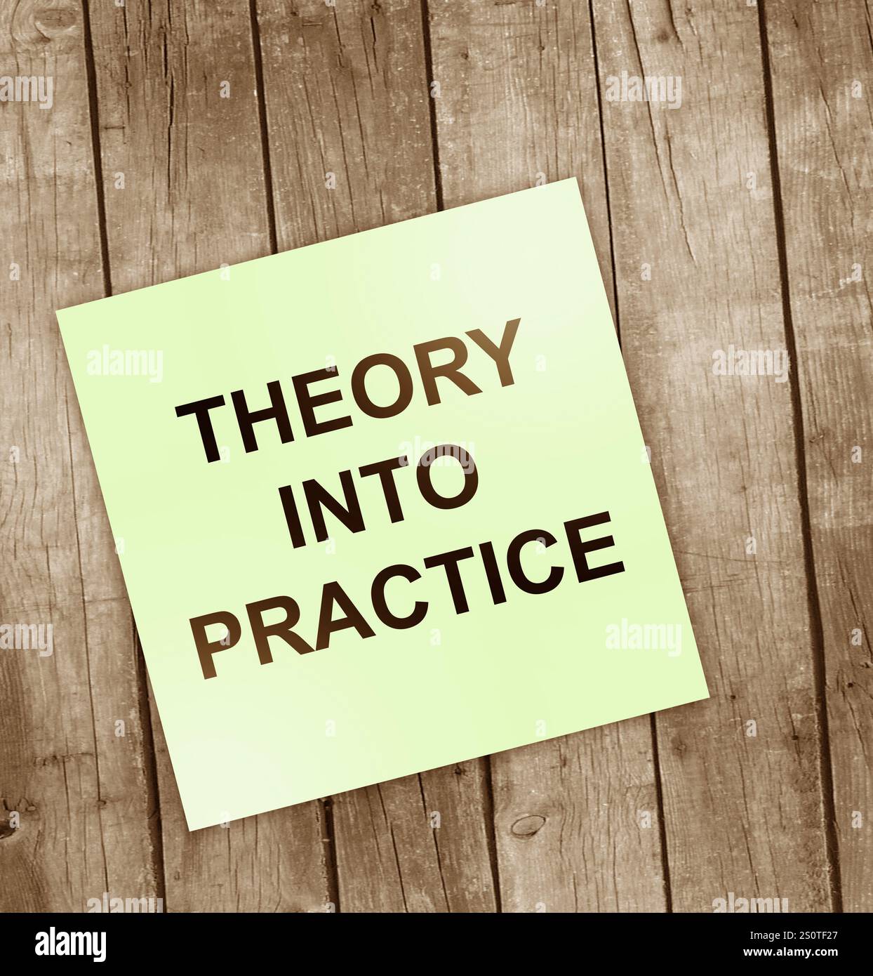 Theory Into Practice text message written on note page. Education and business concept Stock ...