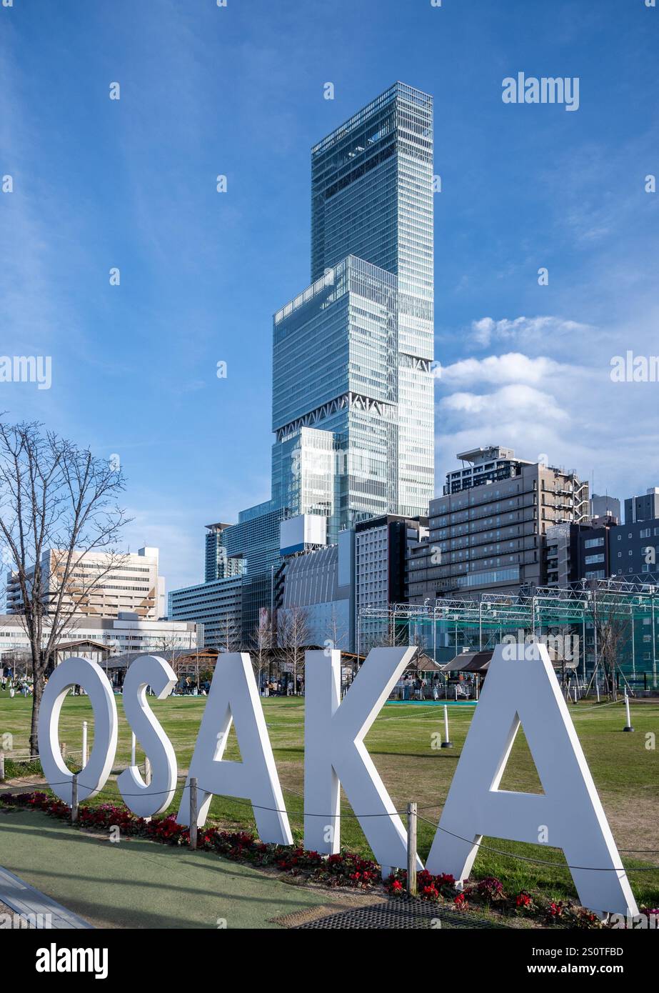 Large Osaka Sign in Tenshiba Park in front of tall building Stock Photo ...