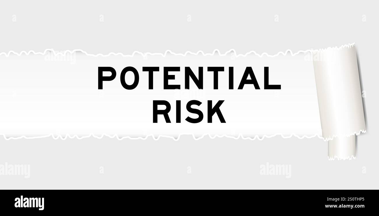 Ripped gray paper background that have word potential risk under torn ...
