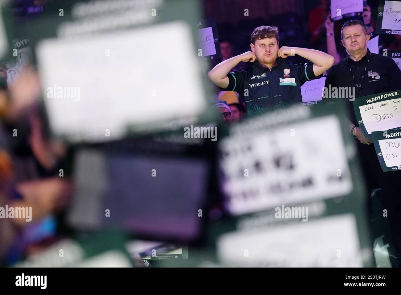 Kevin Doets walks out to play Krzysztof Ratajski (not pictured) in ...