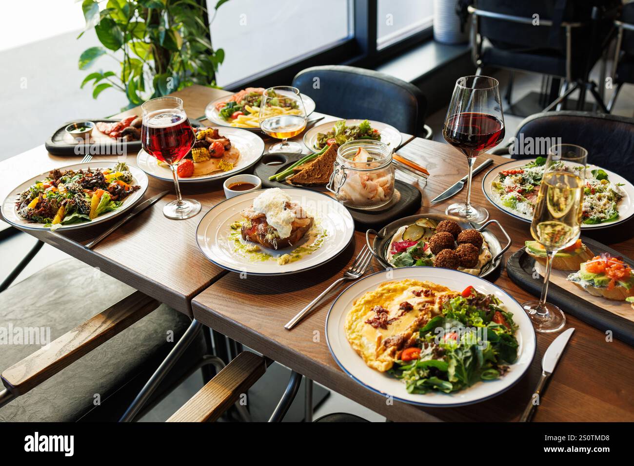 festive table with different gourmet food for a holiday in a cafe or ...