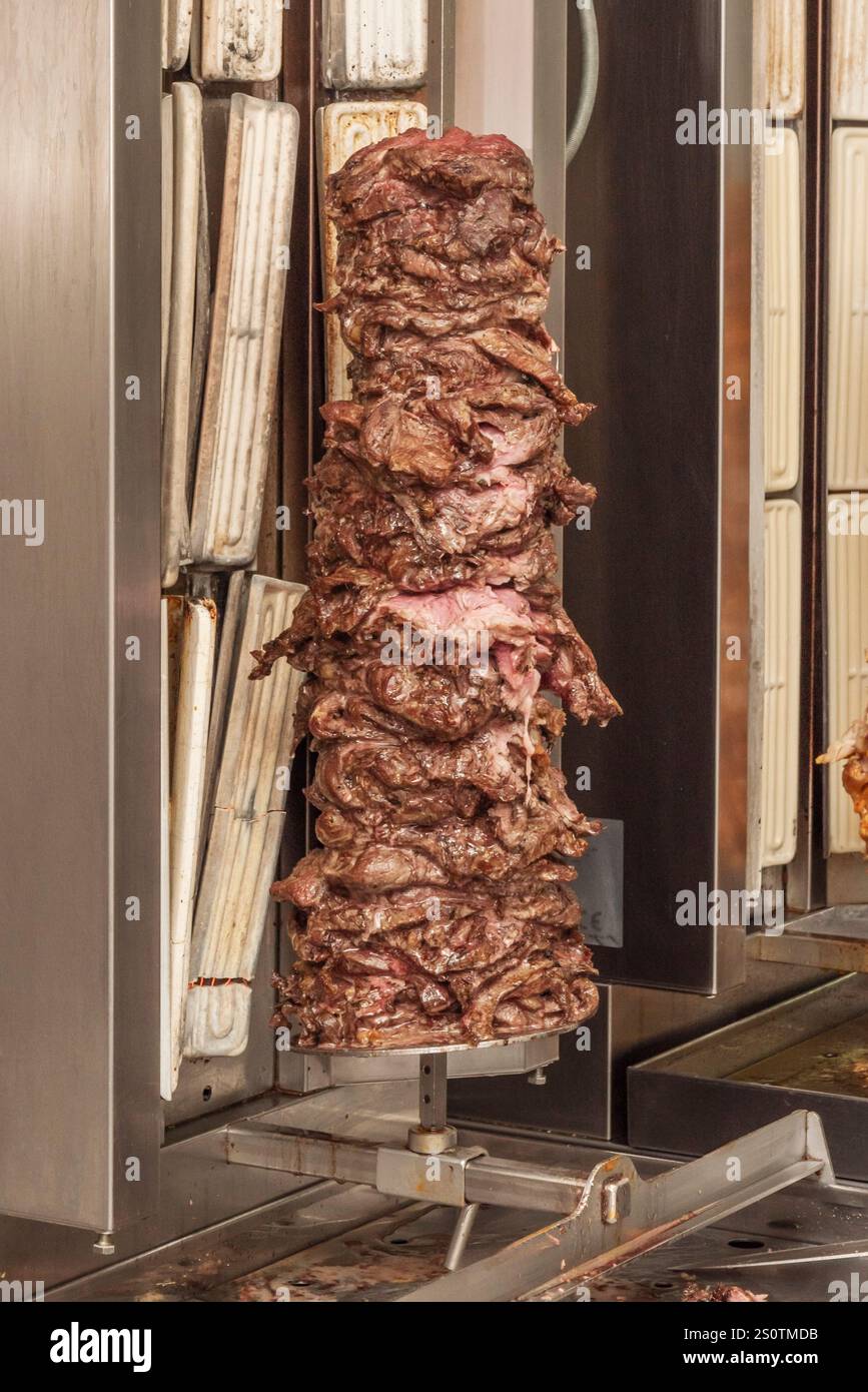 Prepared with marinated lamb meat and slowly cooked on a vertical ...