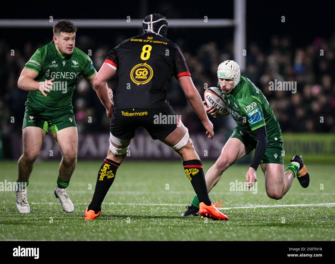 Galway, Ireland. 28th December, 2024. Connacht's Mack Hansen evades a ...