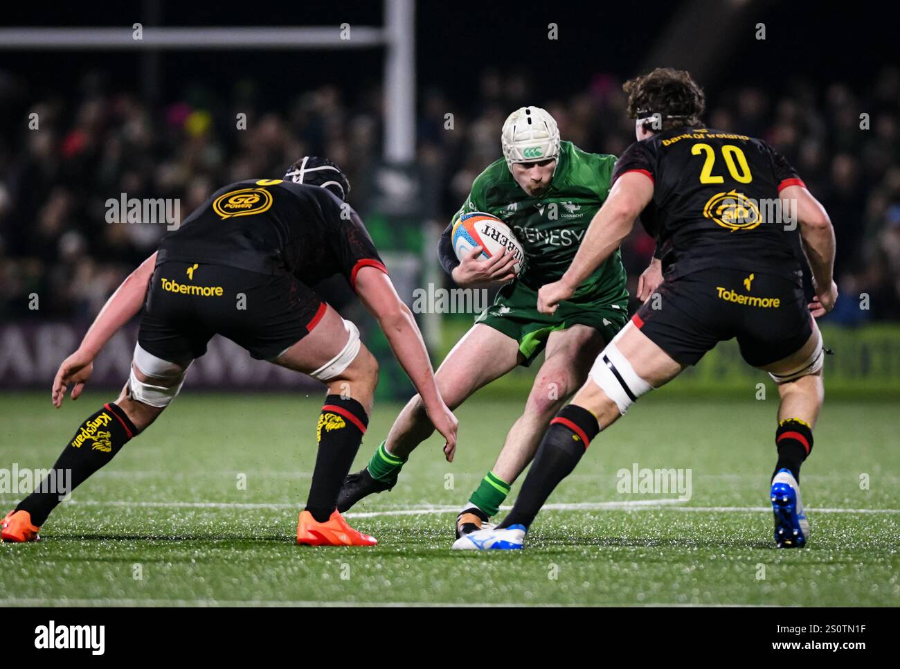 Galway, Ireland. 28th December, 2024. Connacht's Mack Hansen evades a ...