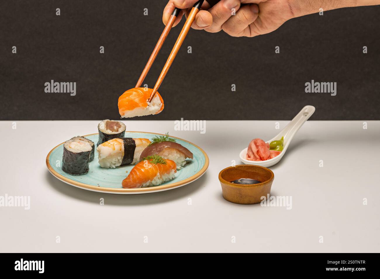 Nigiri: Small portions of rice with a slice of raw fish on top Stock ...