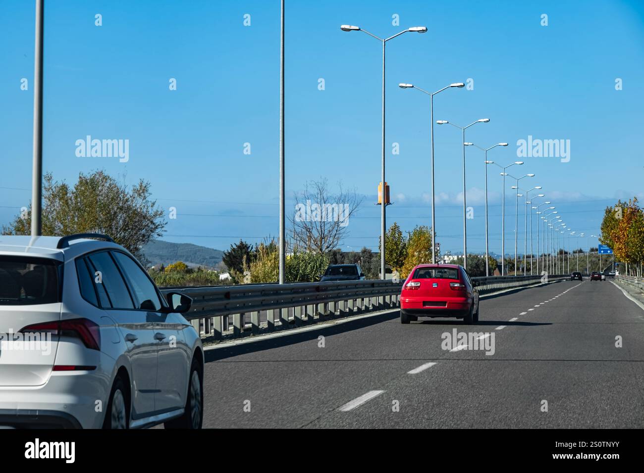 Cars driving on a highway road through the countryside in Europe ...