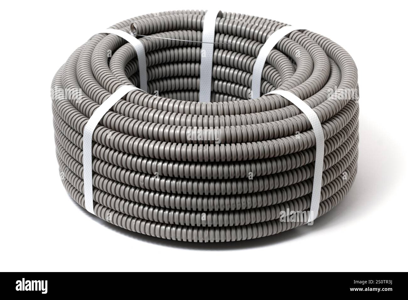 Roll of corrugated grey hose on white background Stock Photo - Alamy
