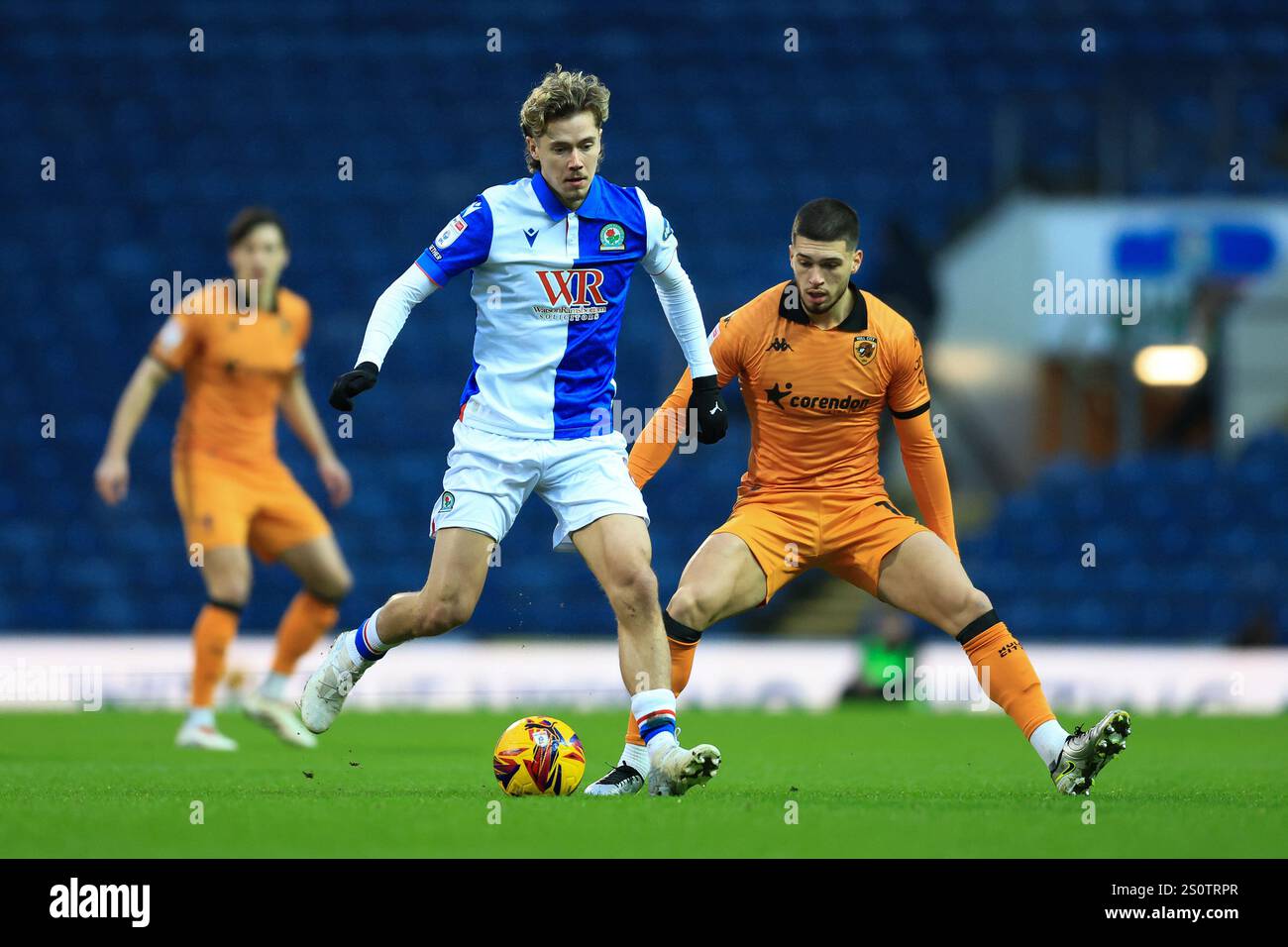 Blackburn Rovers' Todd Cantwell is challenged by Hull City's Xavier ...