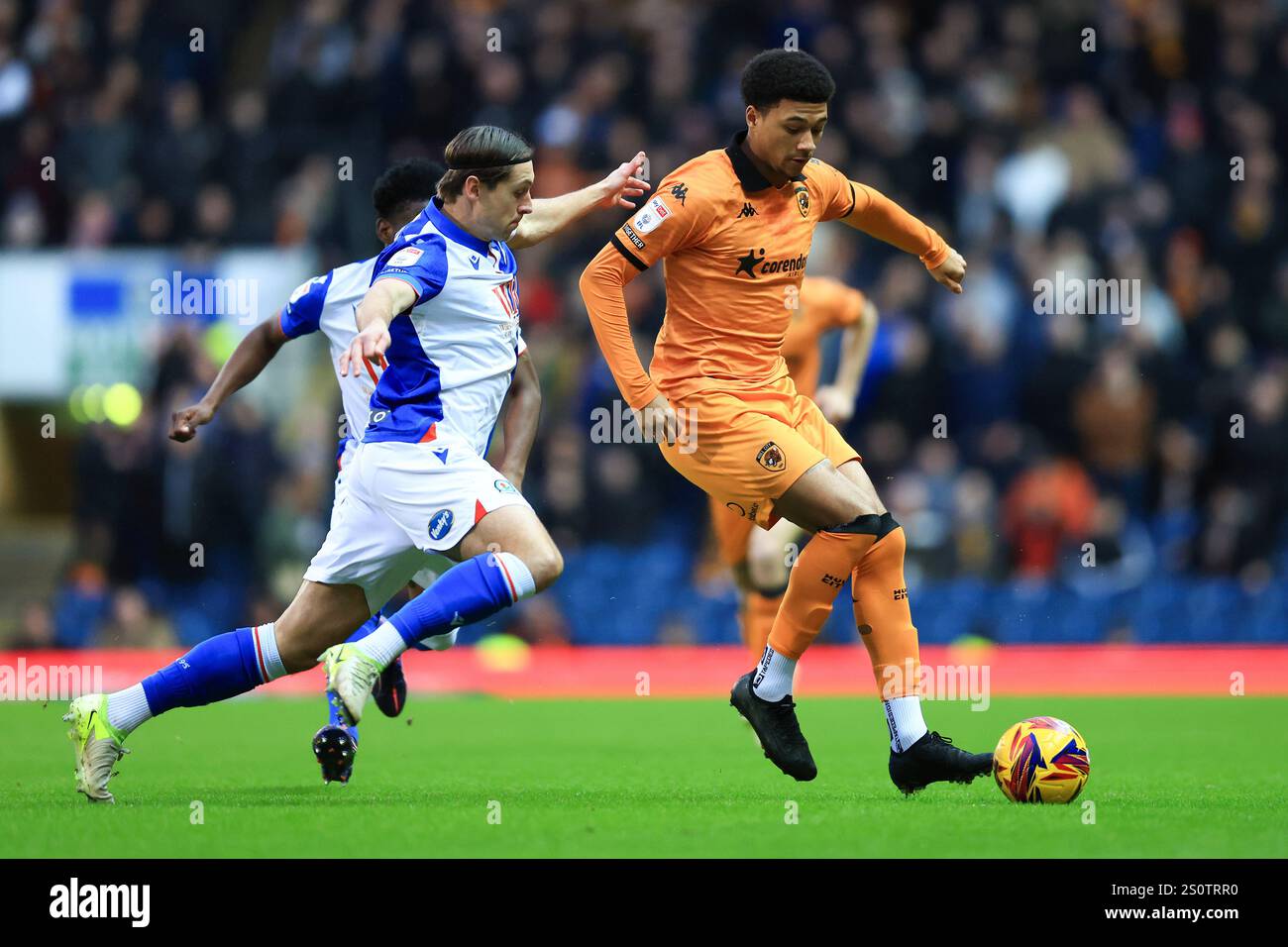 Hull City's Mason Burstow is challenged by Blackburn Rovers' Callum ...
