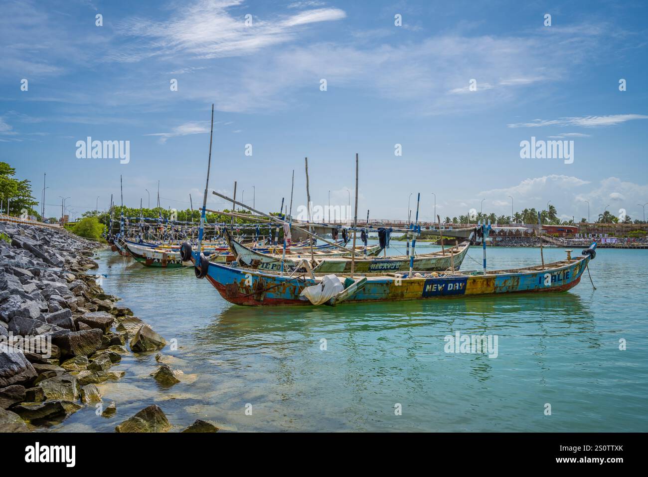Traditional African fishing colorful fishing boats in port reflecting ...