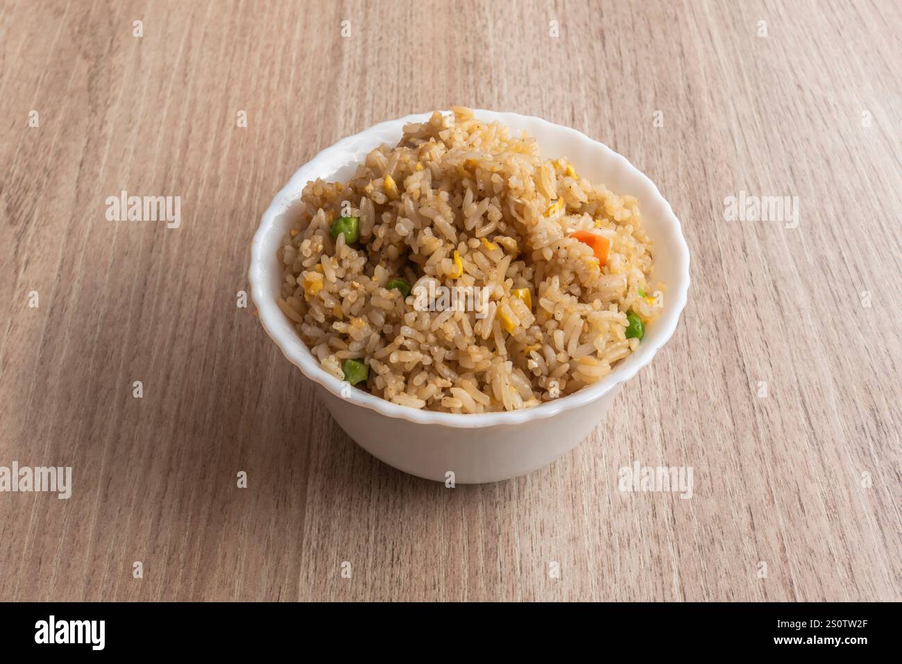 Typical Chinese recipe for three-delicacy rice in a white bowl Stock ...