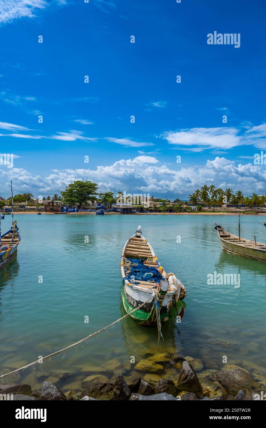 Traditional African fishing colorful fishing boats in port reflecting ...