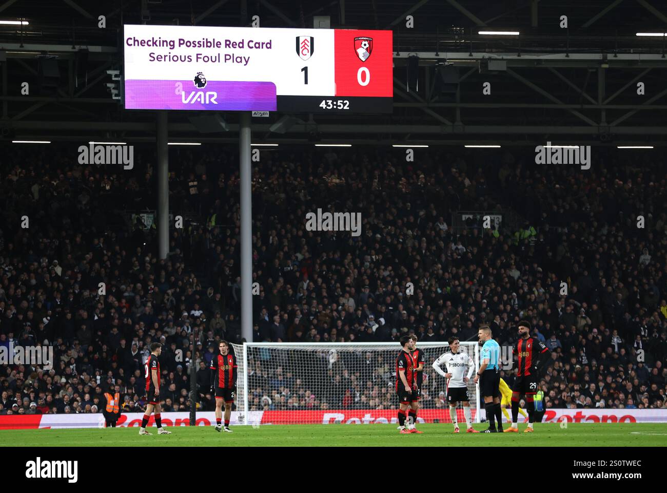 A VAR check for serious foul play goes in favour of Bournemouth's Ryan ...