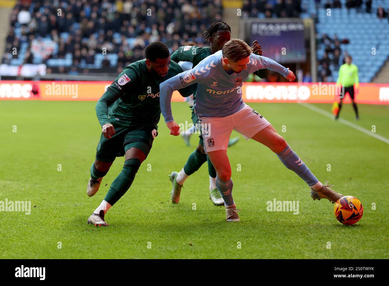 Coventry City's Jack Rudoni (right) and Millwall's Japhet Tanganga ...