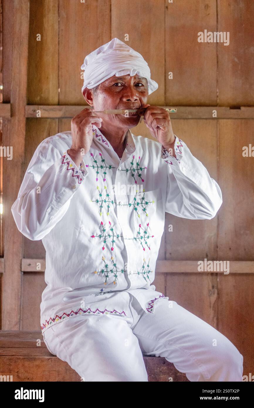 Arumanen Manuvu tribe musician holding a kubing, an indigenous ...
