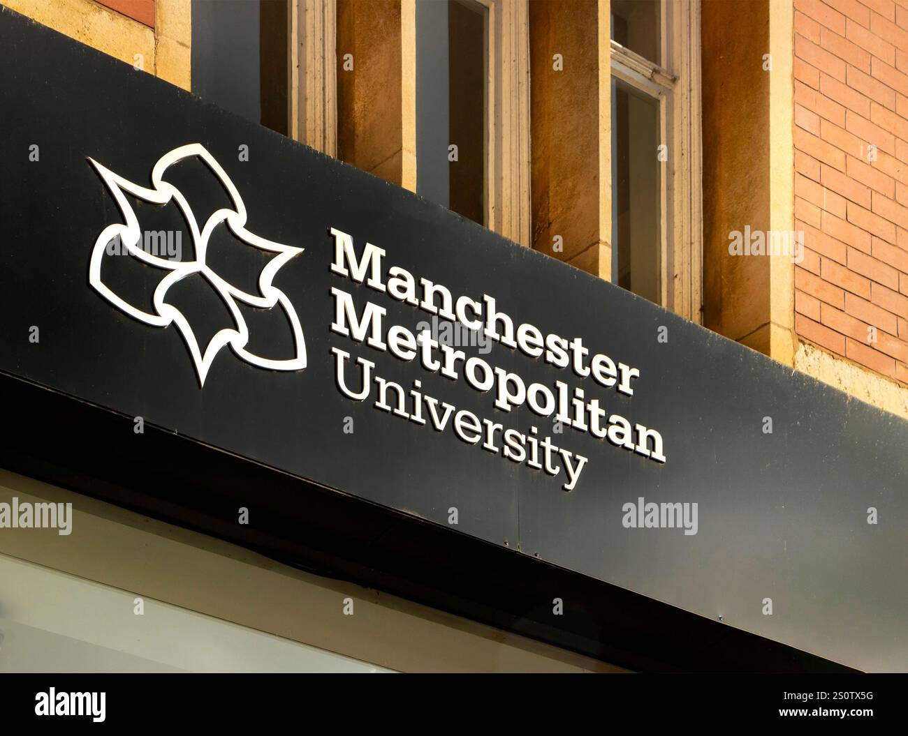 Manchester Metropolitan University MMU logo displayed on a dark background oxford street ...