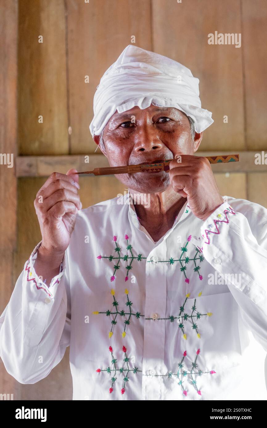 Arumanen Manuvu tribe musician holding a kubing, an indigenous ...