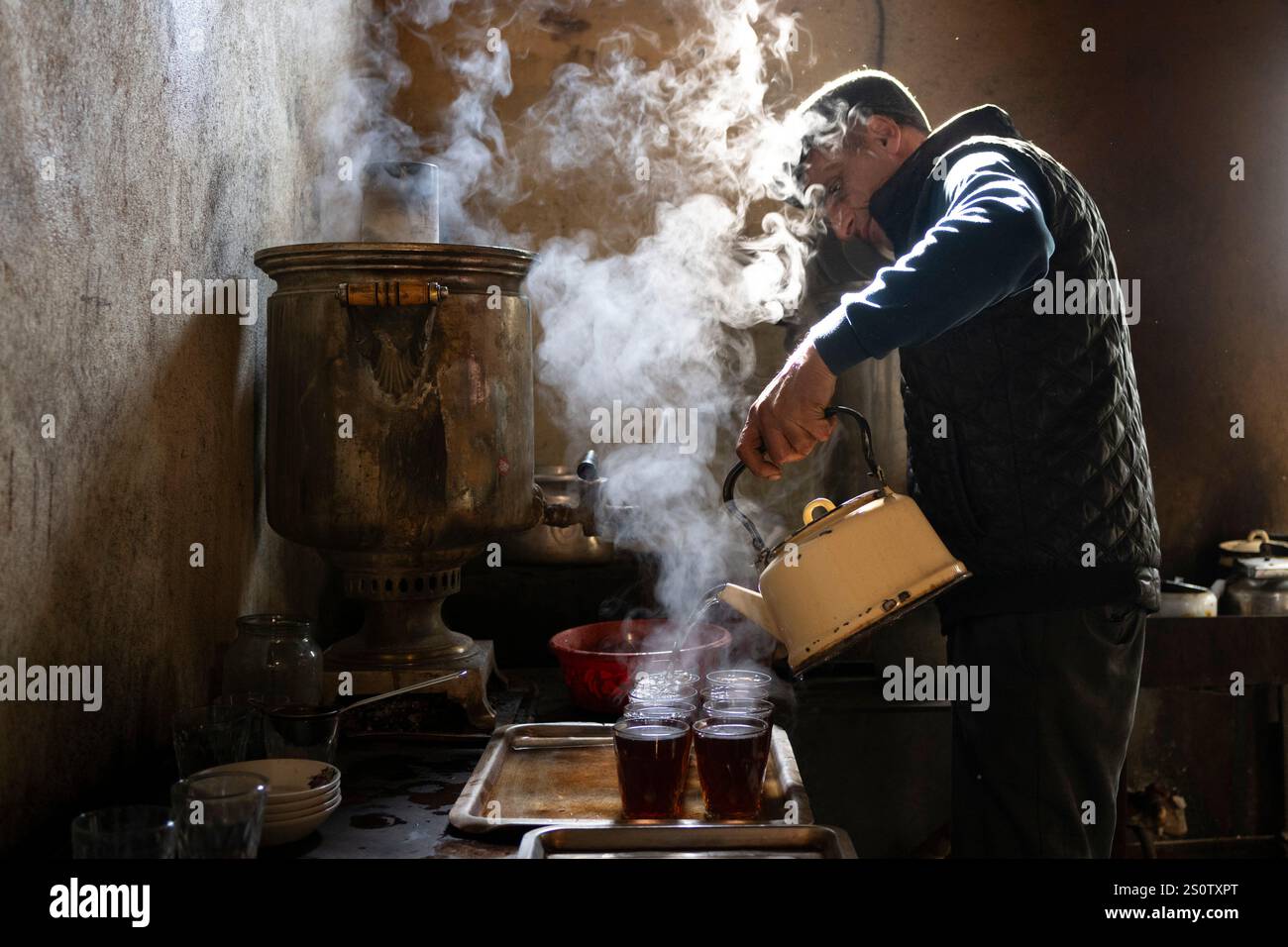 Seki, Azerbaijan. 31st Oct, 2024. A man prepares tea in a samovar at ...