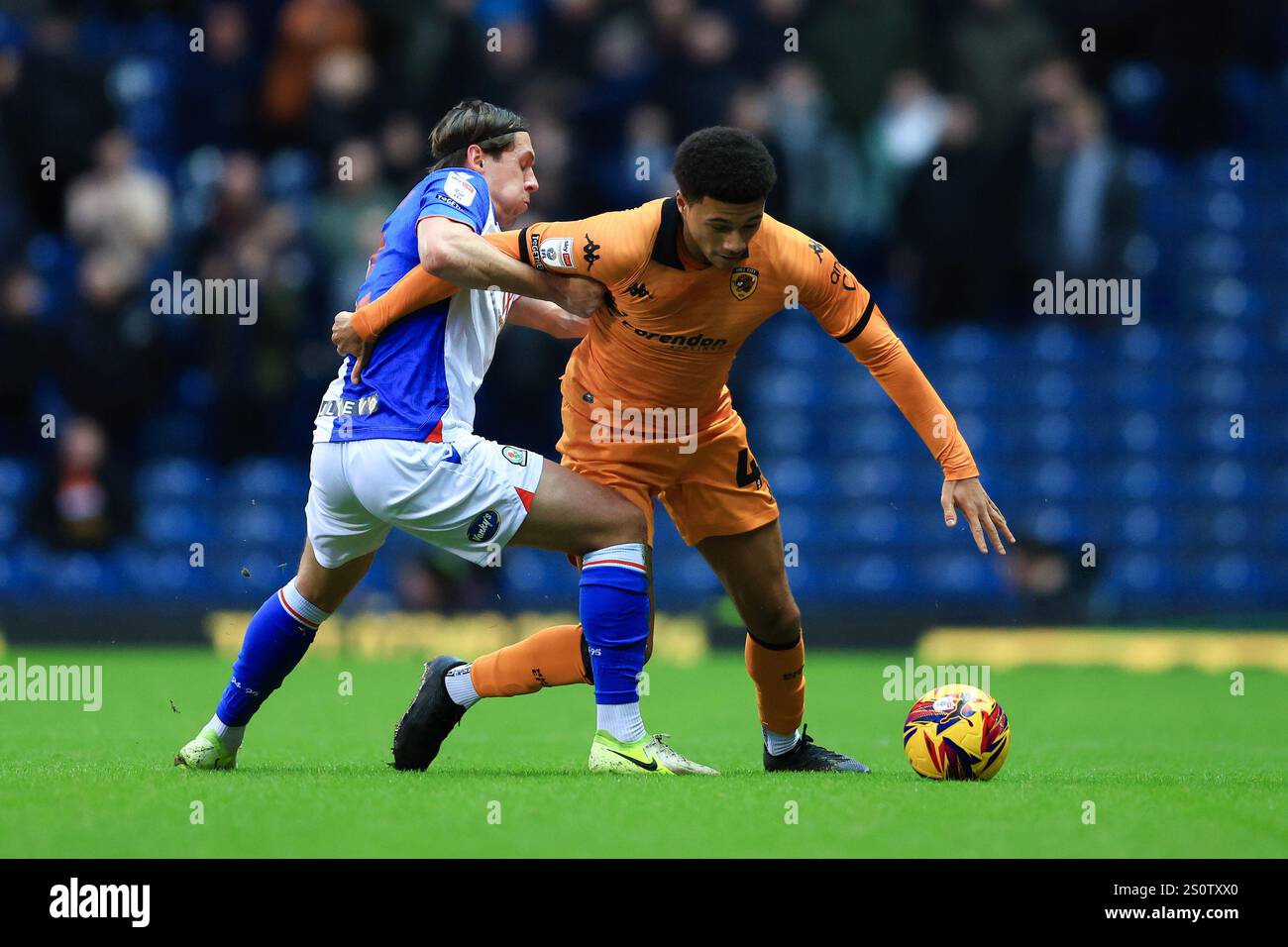 Hull City's Mason Burstow is challenged by Blackburn Rovers' Callum ...