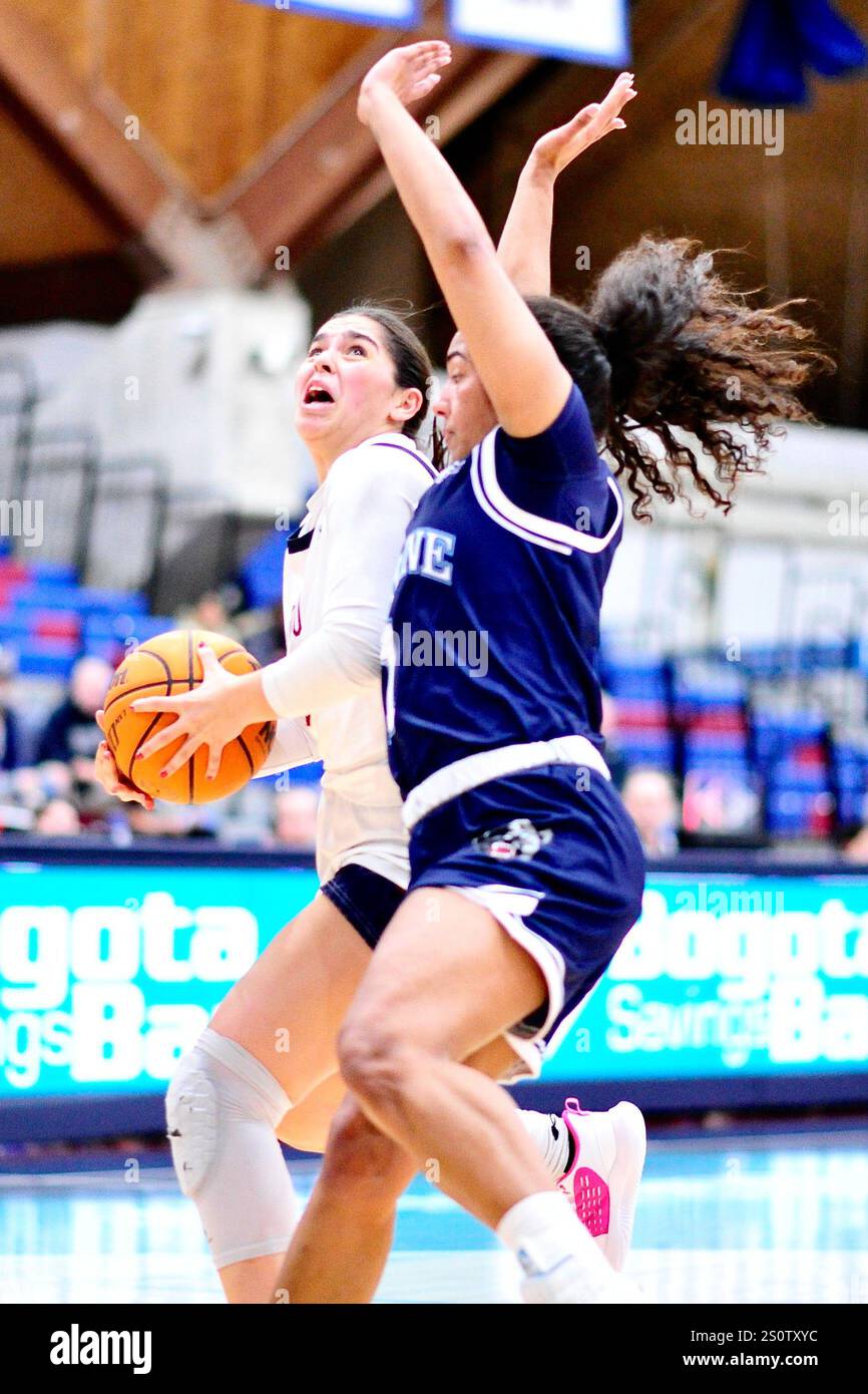 Hackensack, USA. 28th Dec, 2024. Abaigeal Babore (13) drives the lane ...
