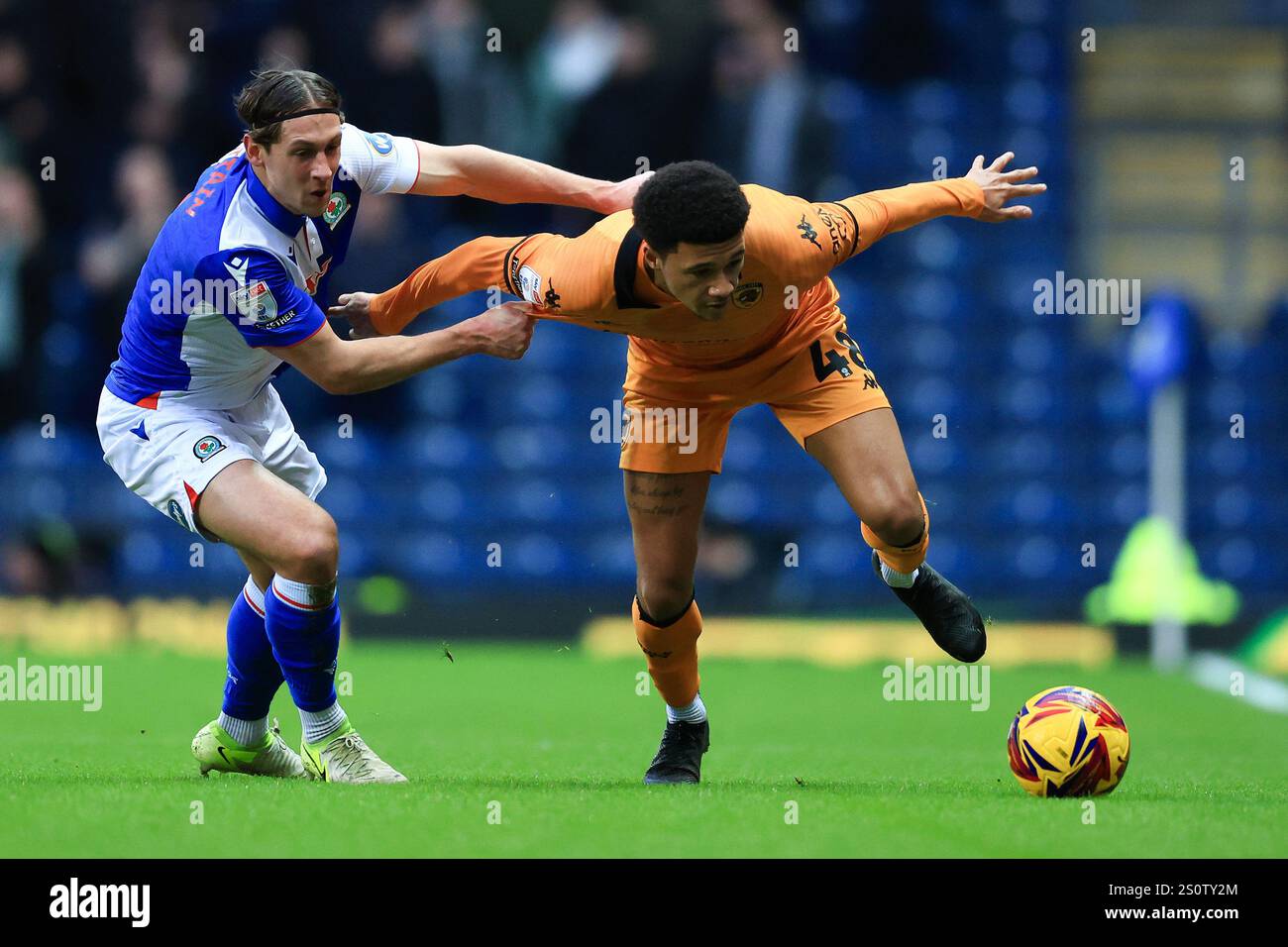 Hull City's Mason Burstow is challenged by Blackburn Rovers' Callum ...
