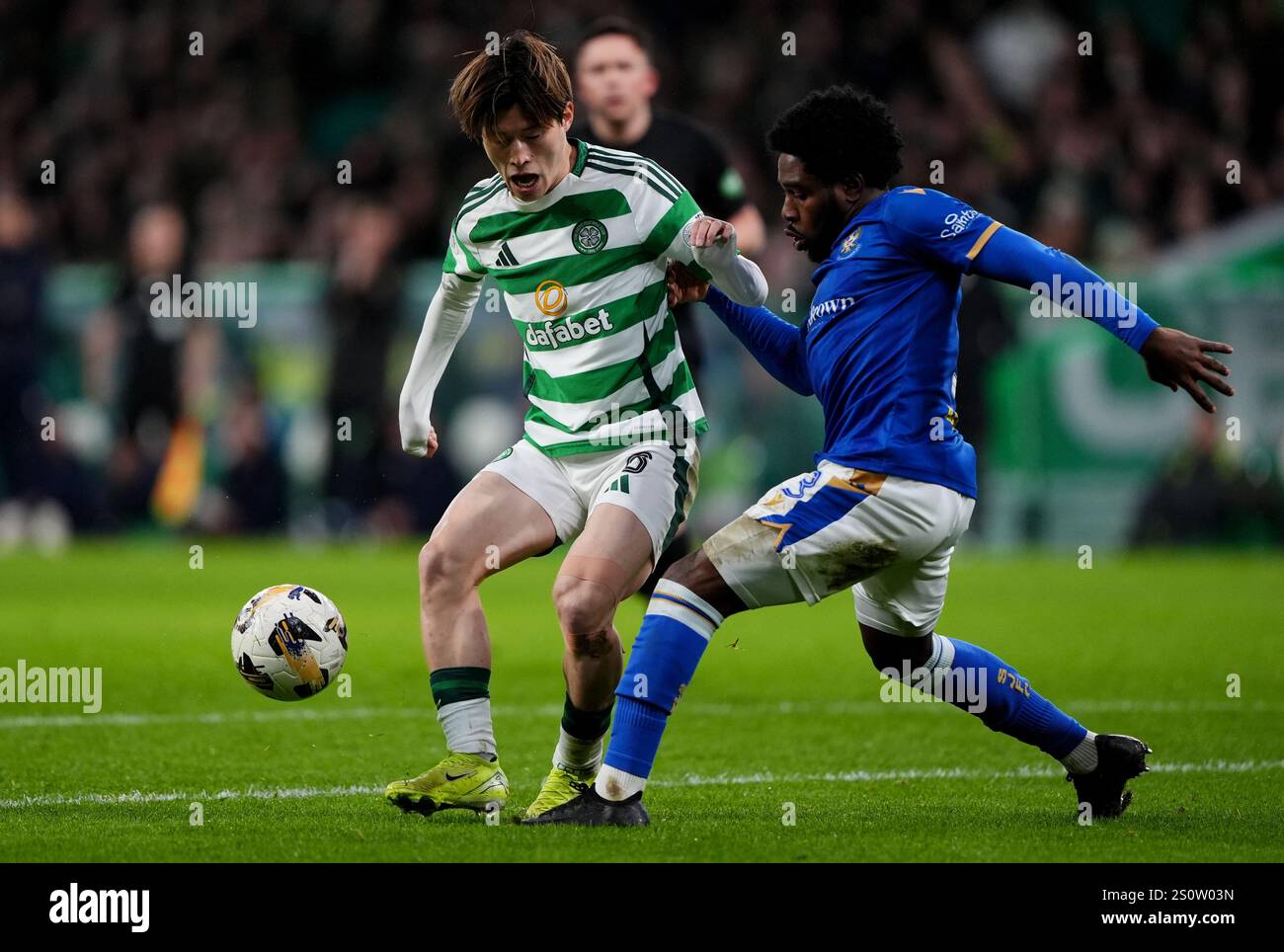 Celtic's Kyogo Furuhashi (left) and St Johnstone's Andre Raymond battle ...